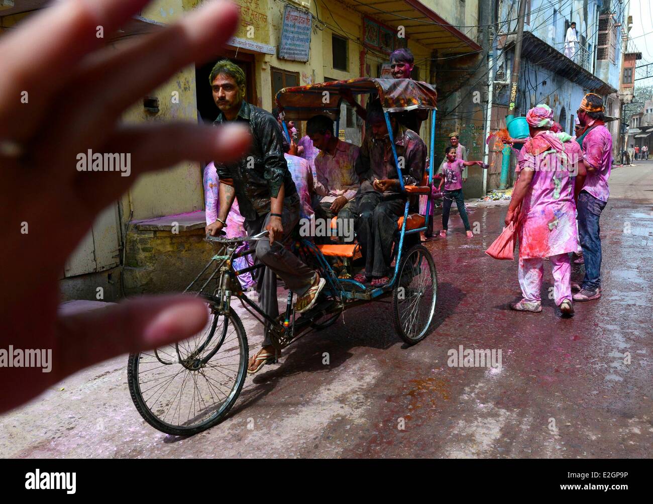 India Uttar Pradesh State Mathura people in street receive coloured ...