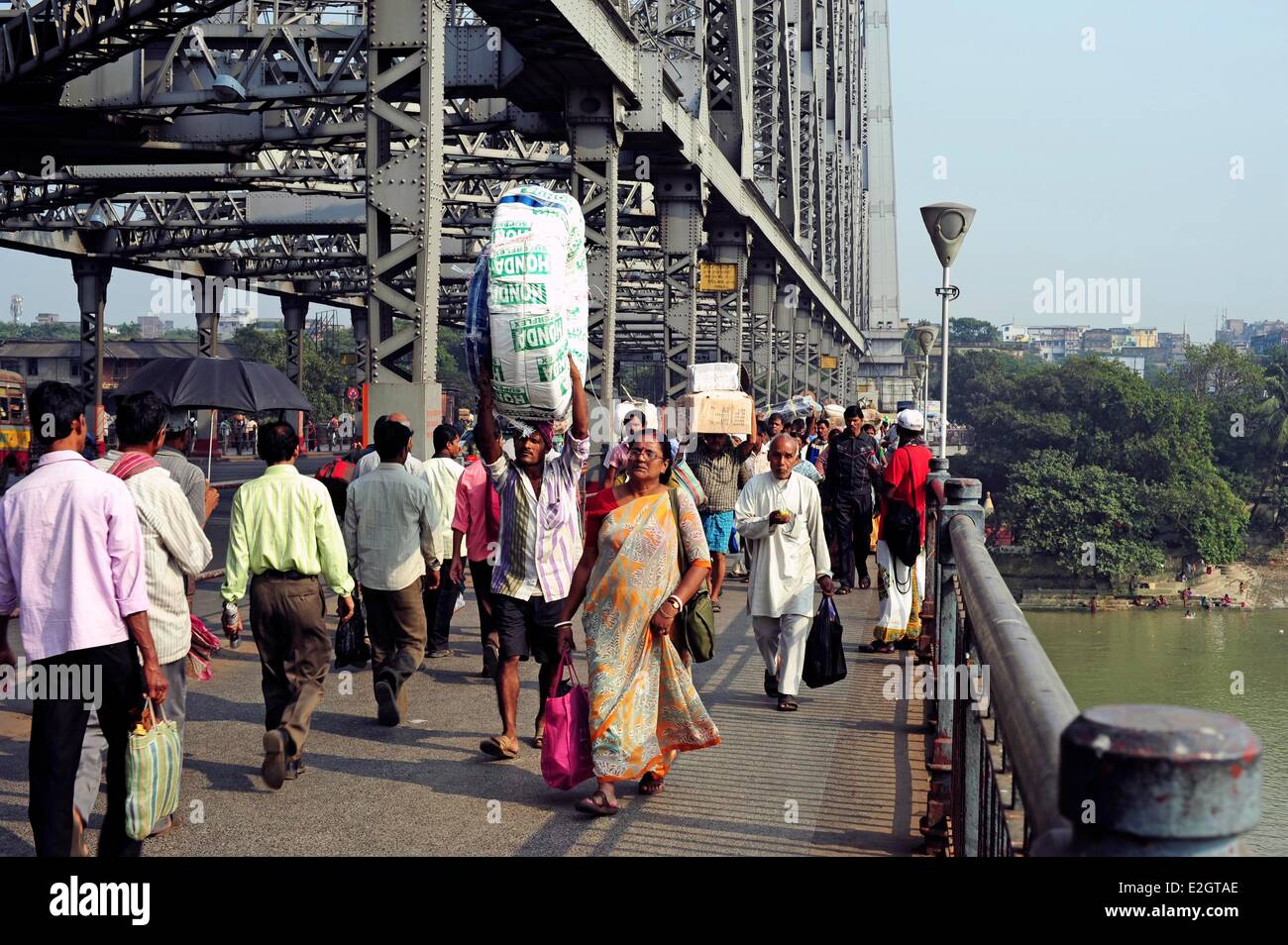 India West Bengal state Kolkota people carrying goods towards Howrah ...