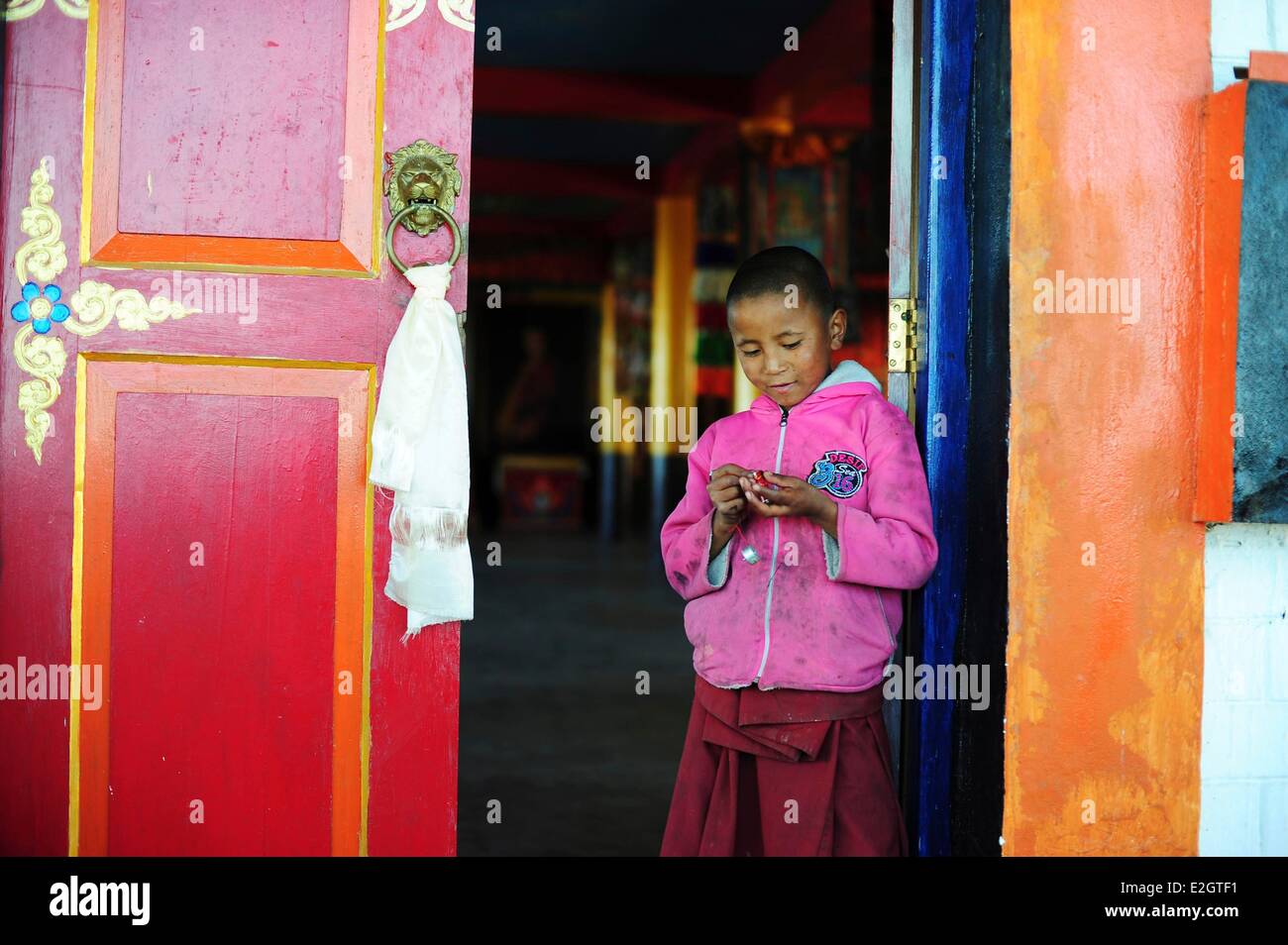 India West Bengal state Meghma monk boy at entrance of monastery Stock ...