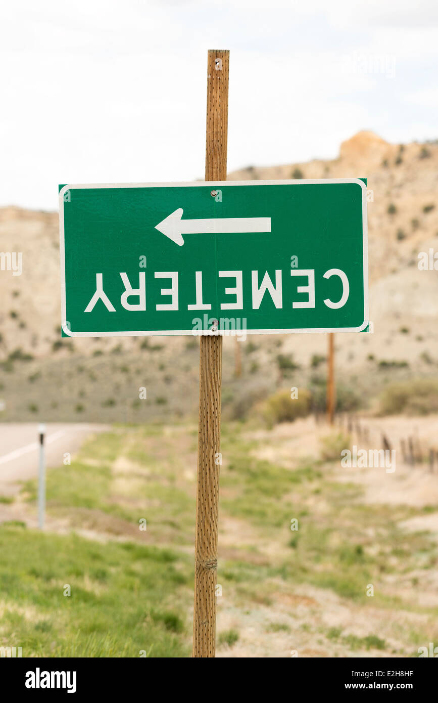 Upside down road sign for a cemetary, Southern Utah Stock Photo - Alamy