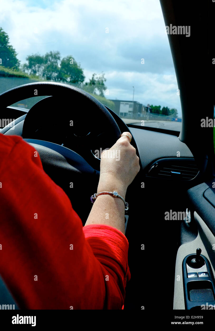 Female hands on steering wheel hi-res stock photography and images - Alamy