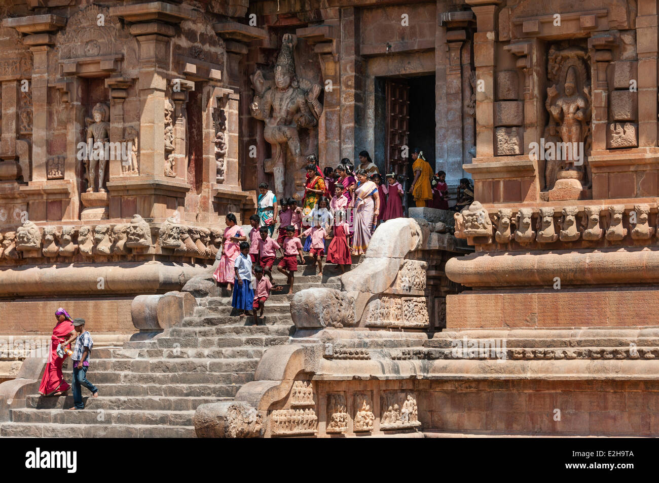 Devout Hindus and children descending a staircase, Brihadeeswarar ...
