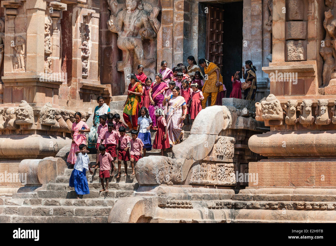 Children and devout Hindus descending a staircase, Brihadeeswarar ...
