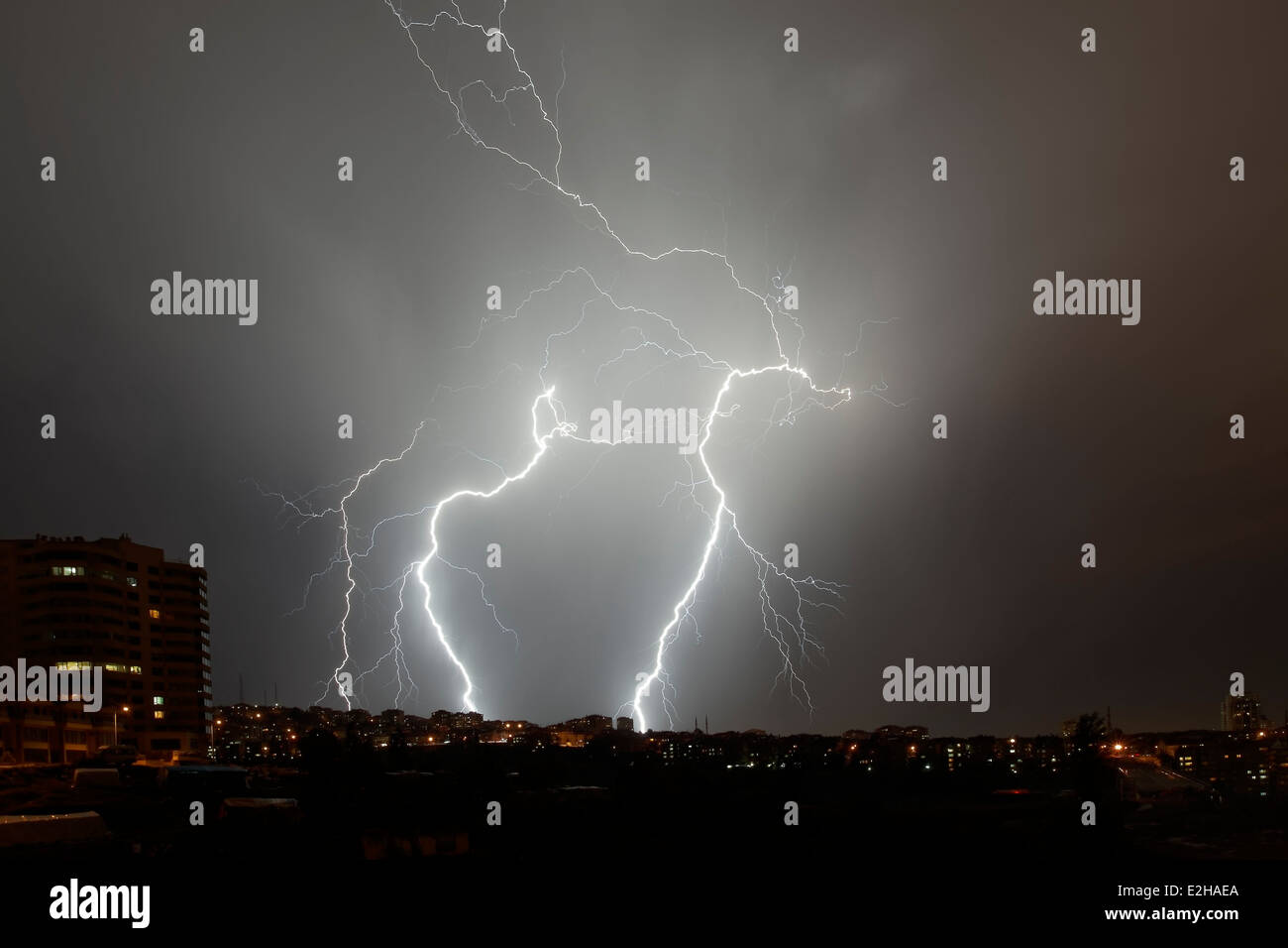 lightning over a city Stock Photo - Alamy