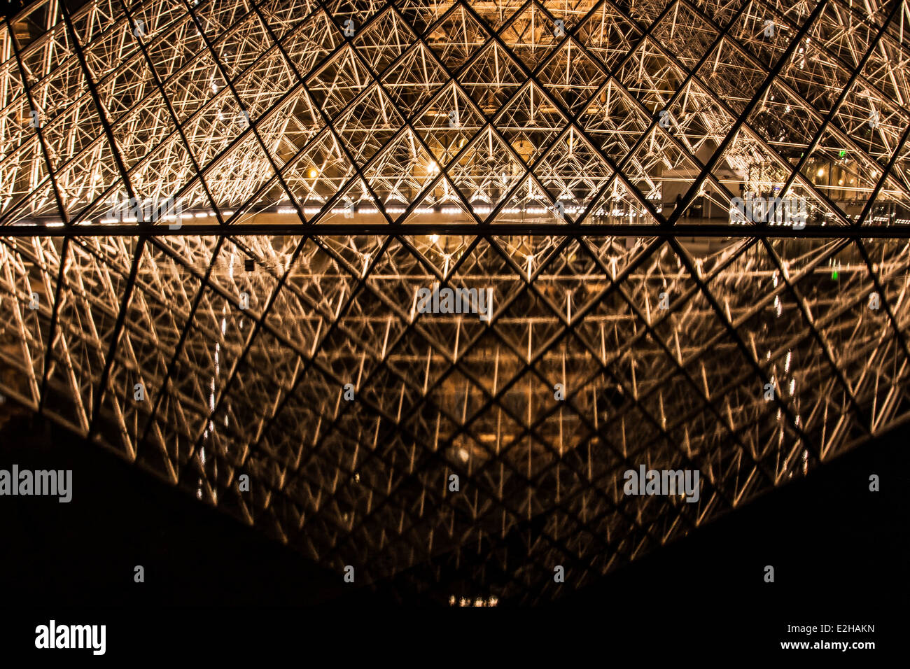 The Louvre Pyramid, a large glass and metal pyramid structure in the ...