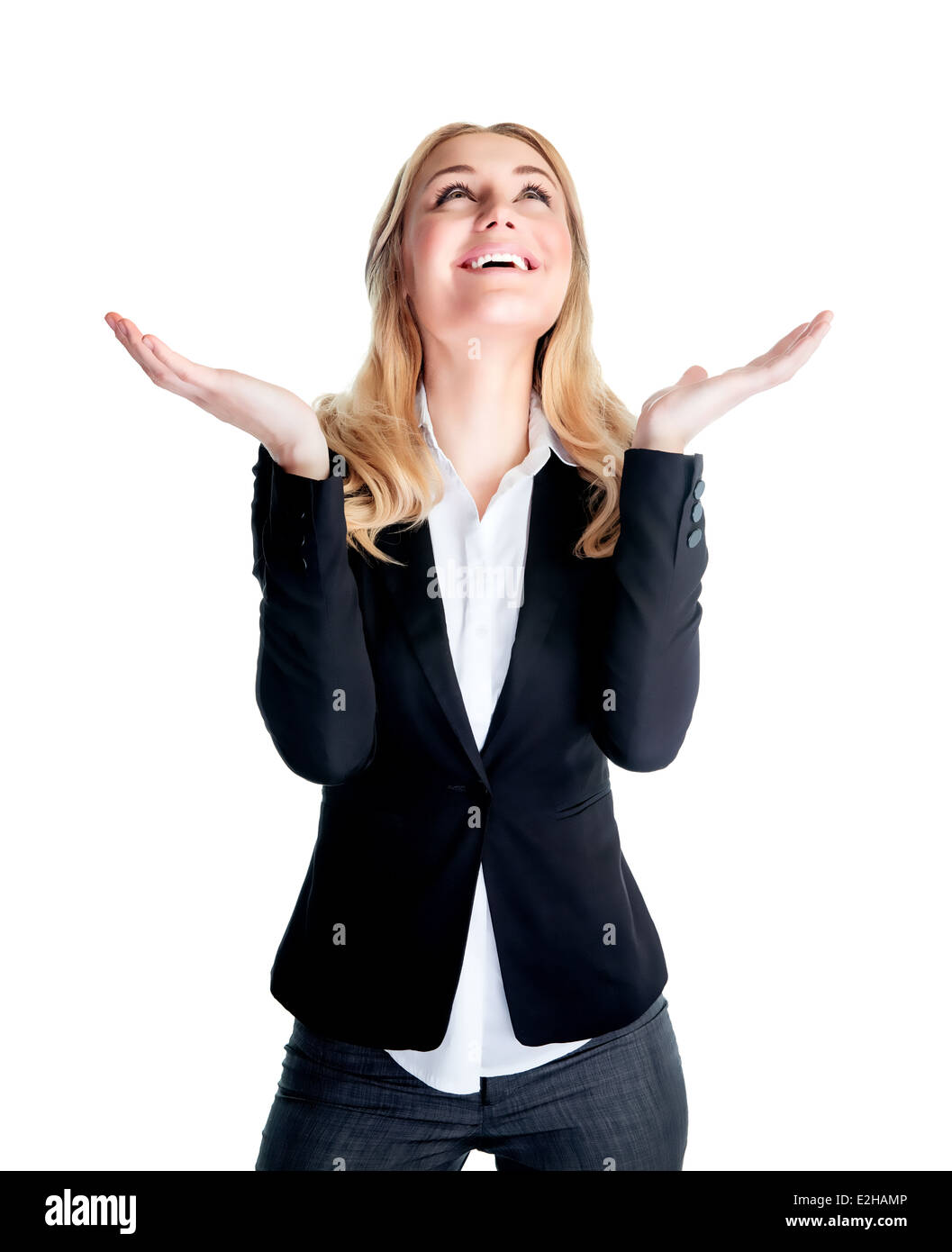 Happy excited business woman with raised hands and looking up waiting ...