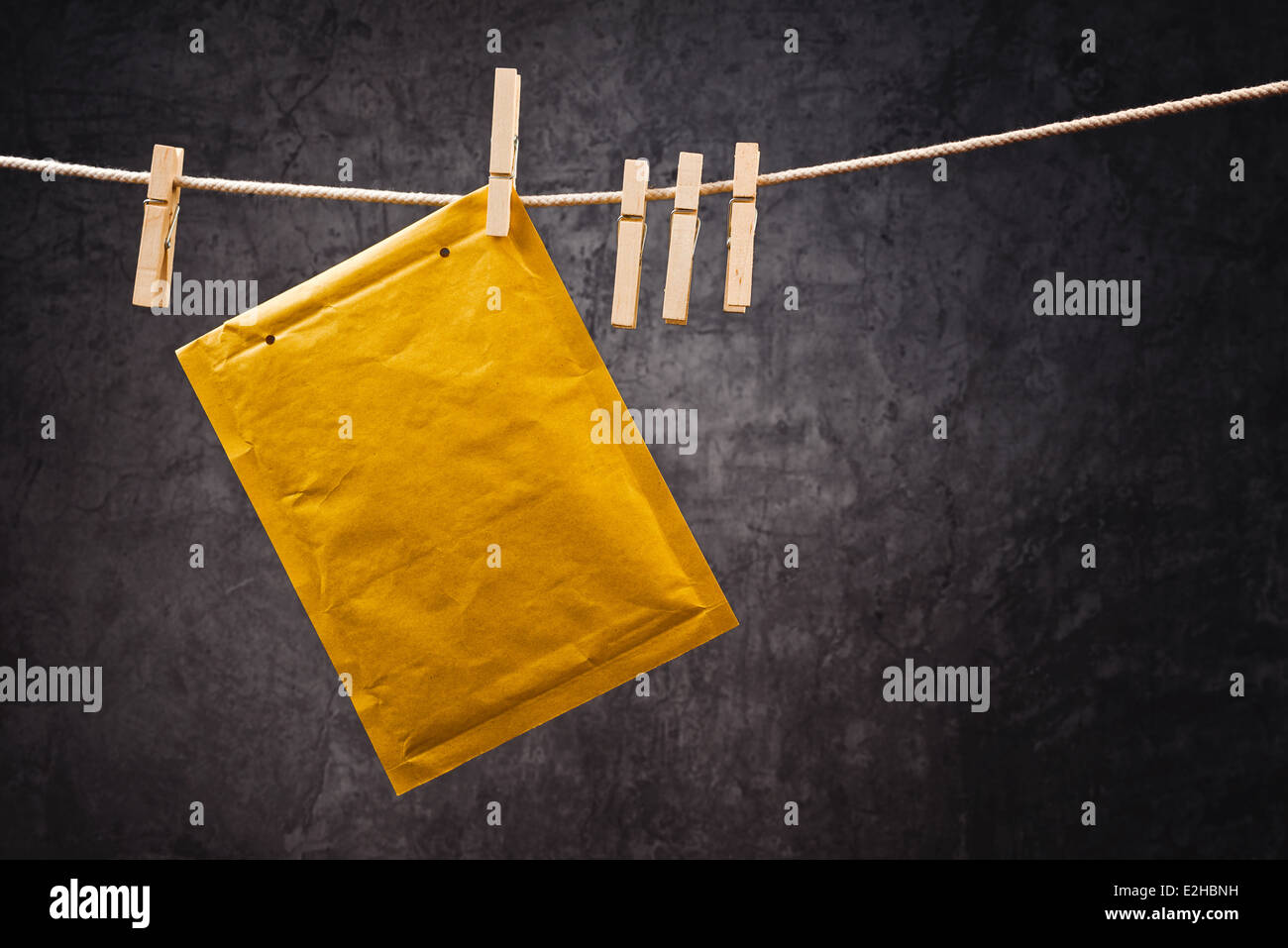Postal mail Envelope hanging on rope attached with clothes pins ...