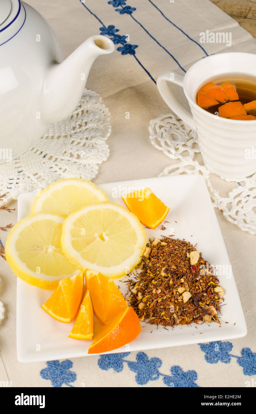 Fruity brew with rooibos and fresh citrus fruits Stock Photo - Alamy
