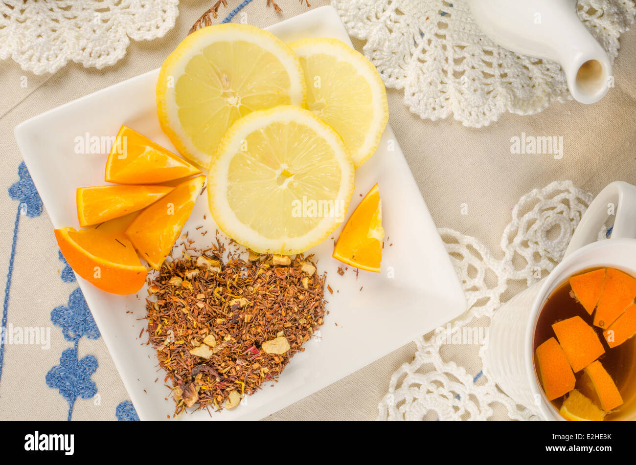 Fruity brew with rooibos and fresh citrus fruits Stock Photo - Alamy