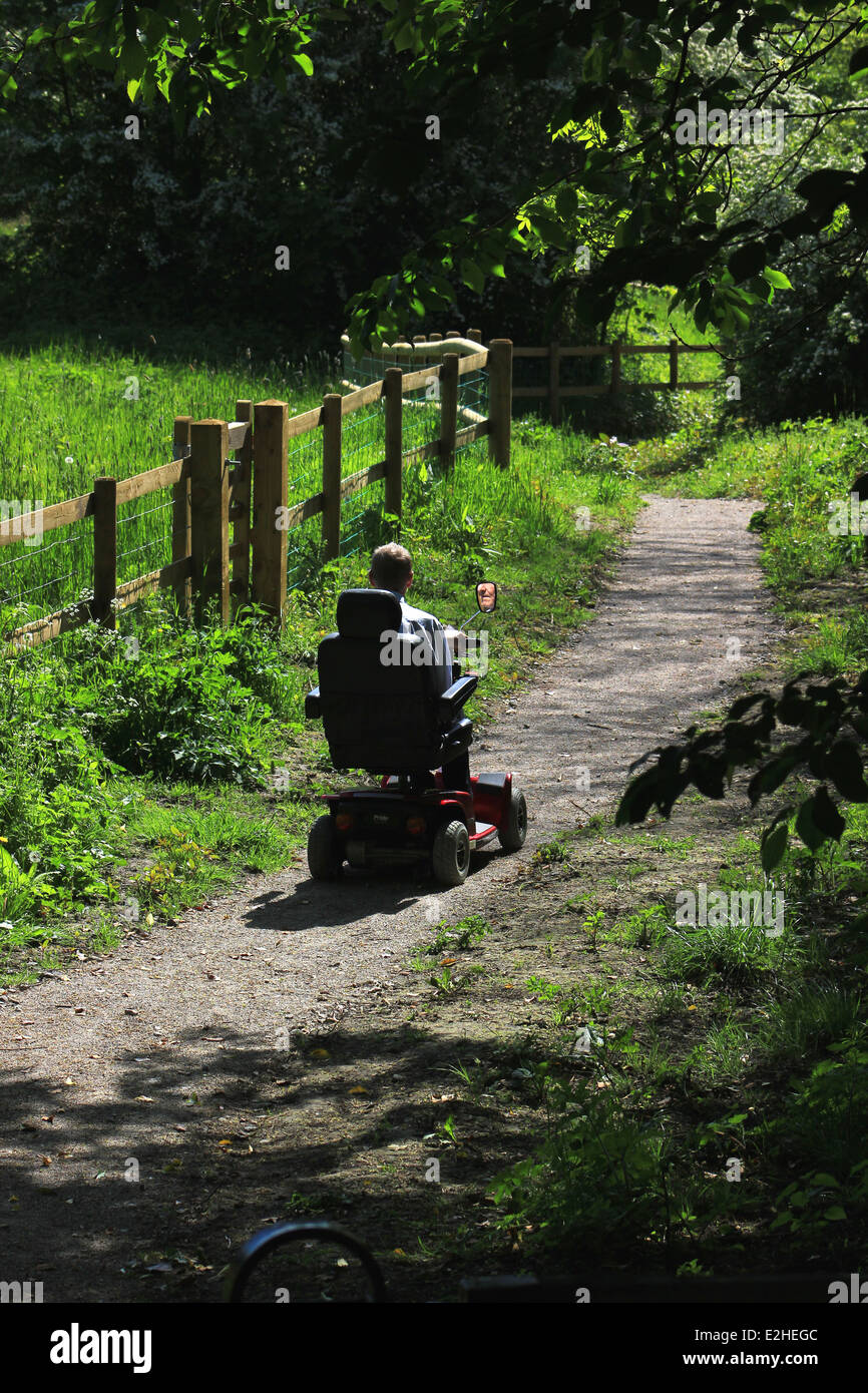 Mobility scooter on public footpath Stock Photo - Alamy