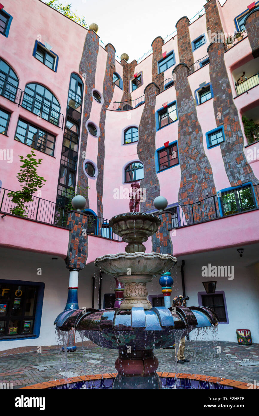 The Hunderwasser building Green Citadel, courtyard with fountain in ...