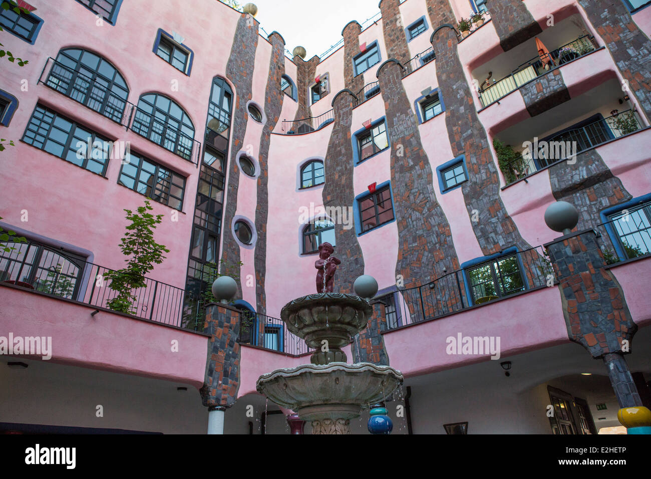 The Hunderwasser building Green Citadel, courtyard with fountain in ...