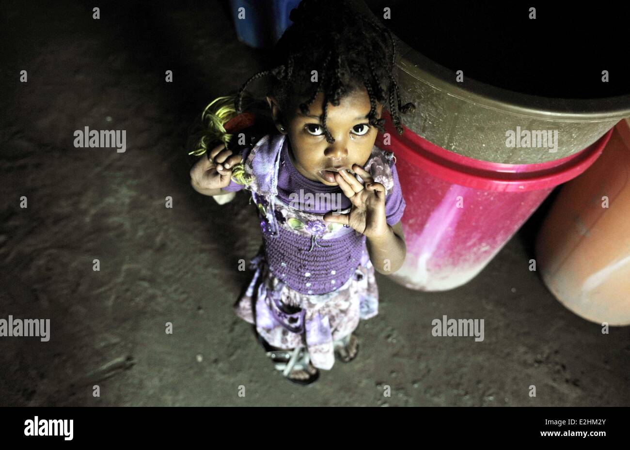 Sanaa, Yemen. 20th June, 2014. An Eritrean girl looks up in a street ...