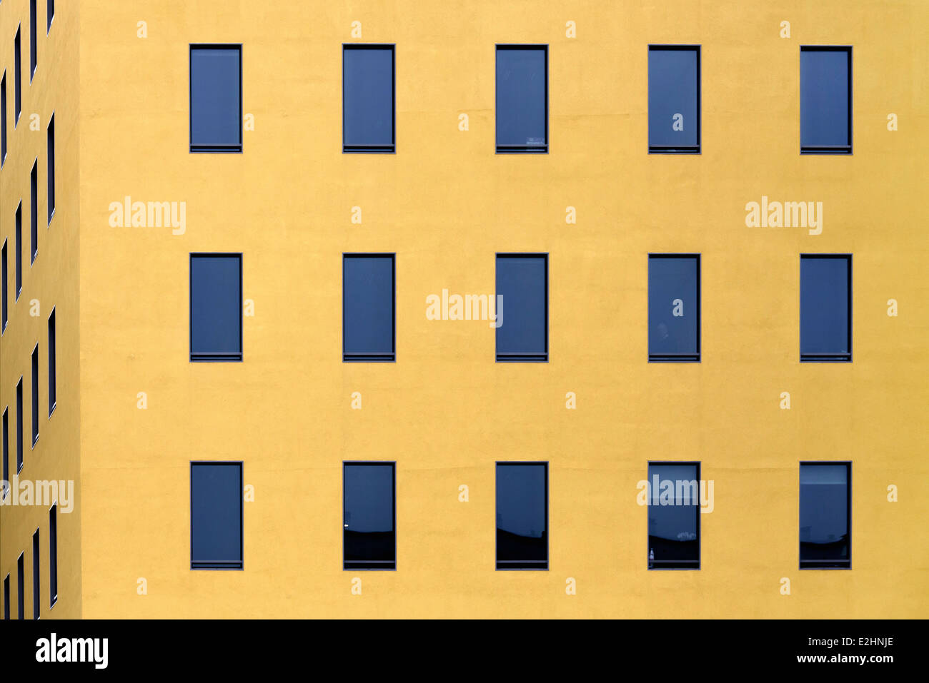 Modern yellow building facade, full frame Stock Photo - Alamy