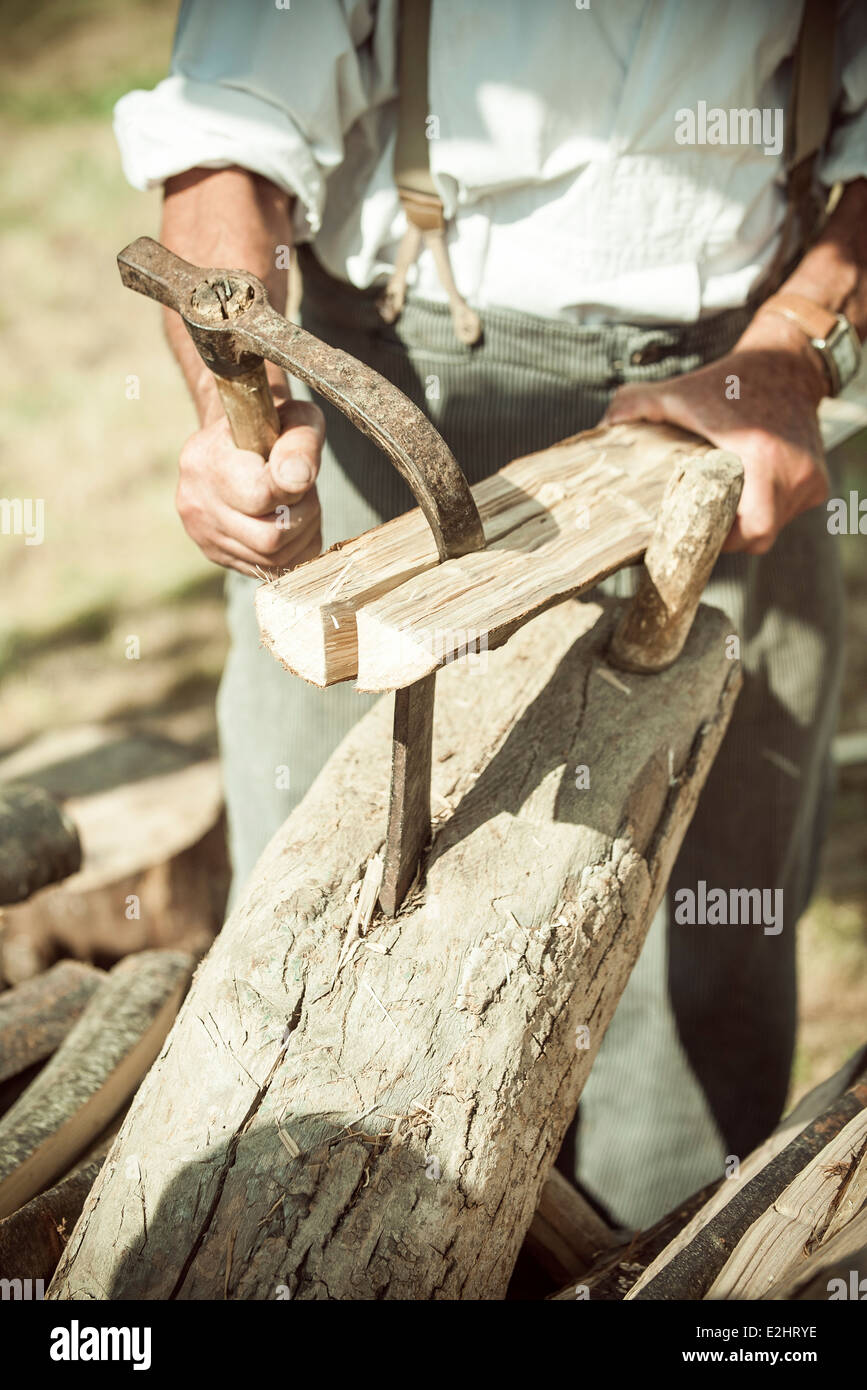 Woodworker splitting wood Stock Photo - Alamy