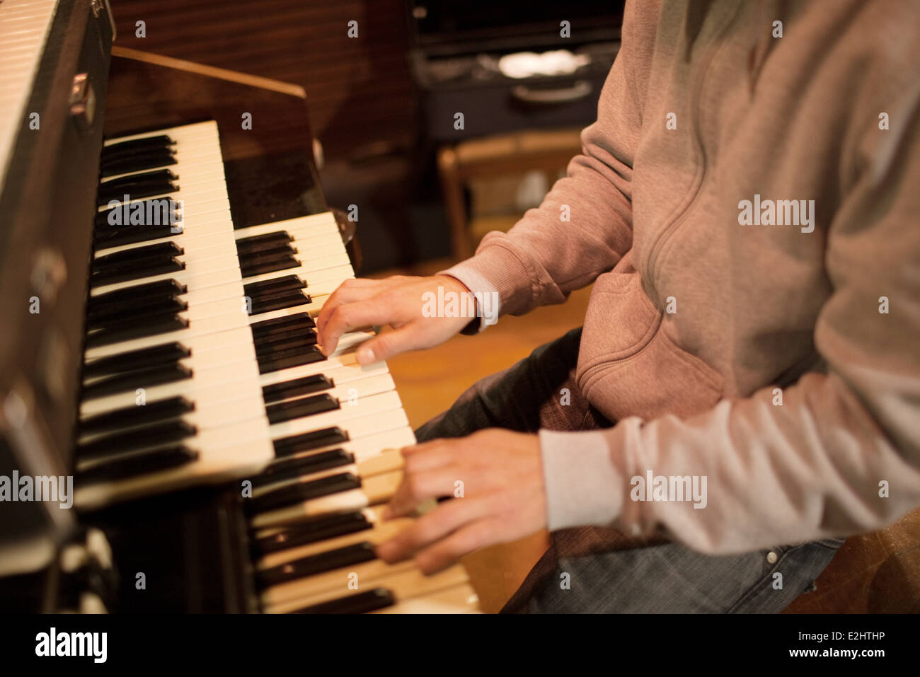 Musician playing organ, cropped Stock Photo - Alamy