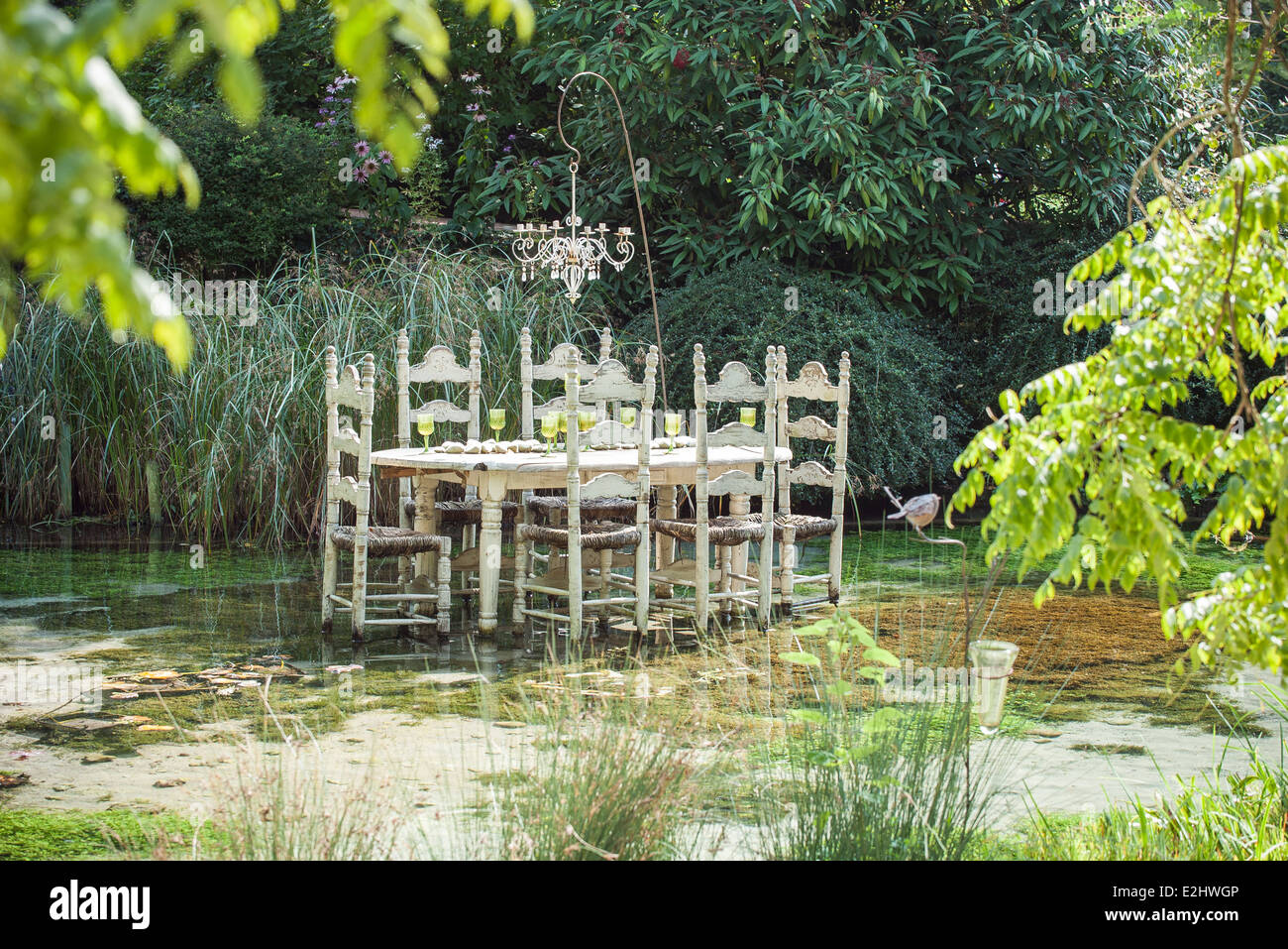 Ornate dining table floating in pond Stock Photo - Alamy