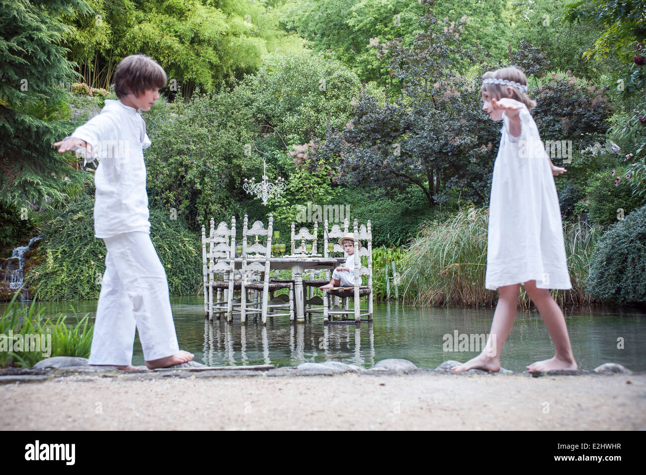 Children playing make-believe outdoors Stock Photo - Alamy