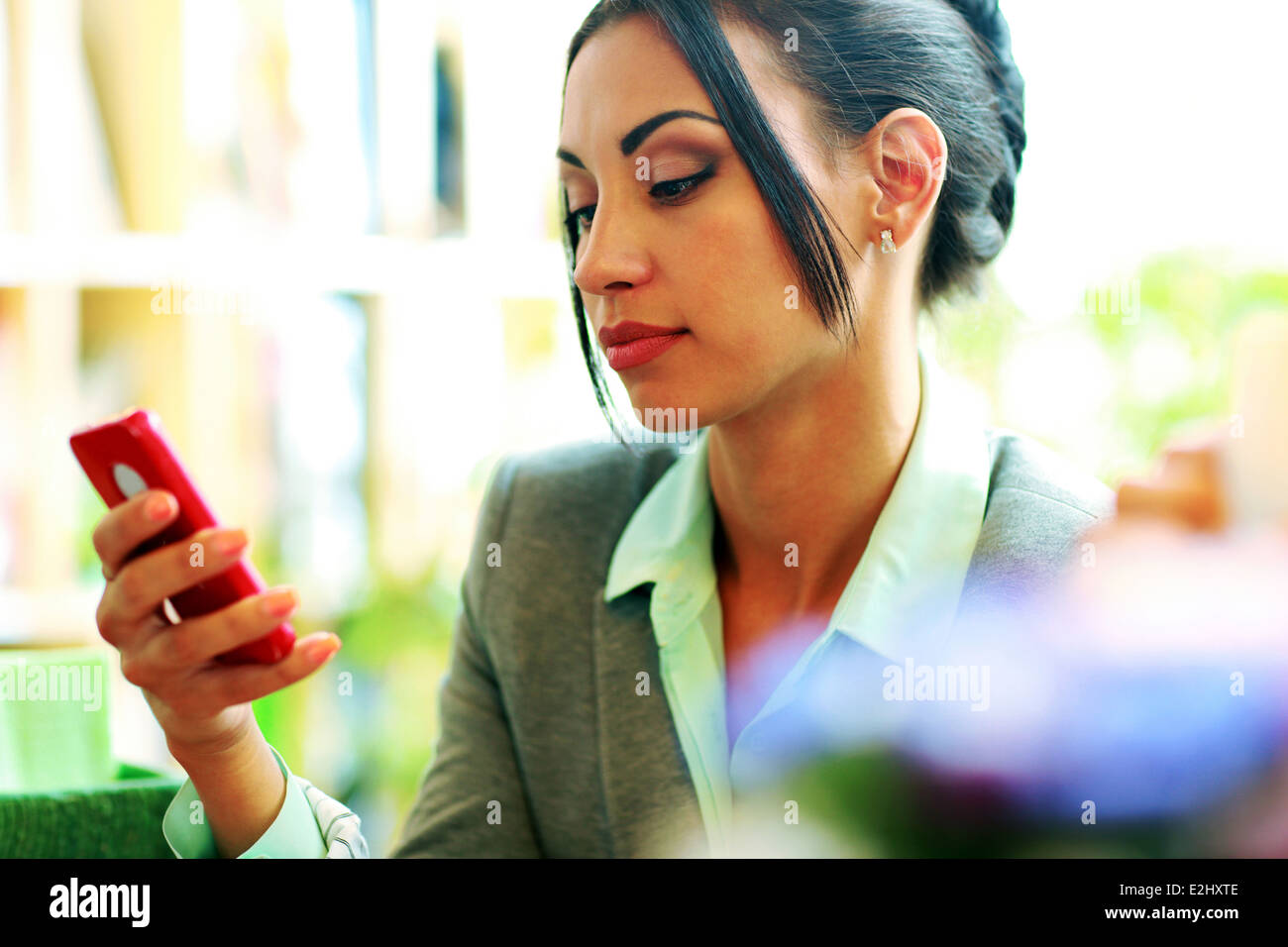 Beautiful businesswoman using smartphone Stock Photo - Alamy