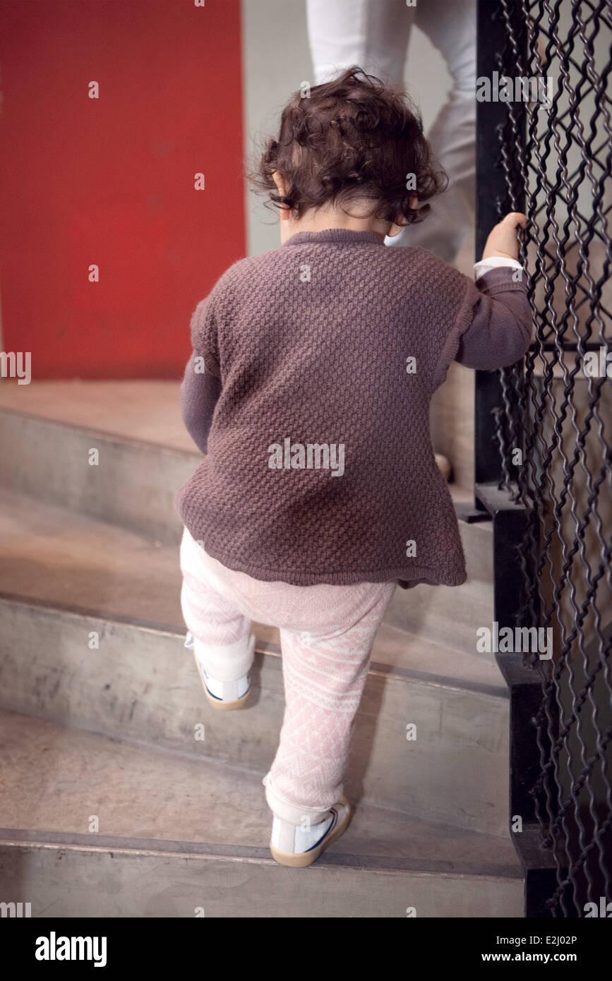 Boy walking up steps rear view hi-res stock photography and images - Alamy