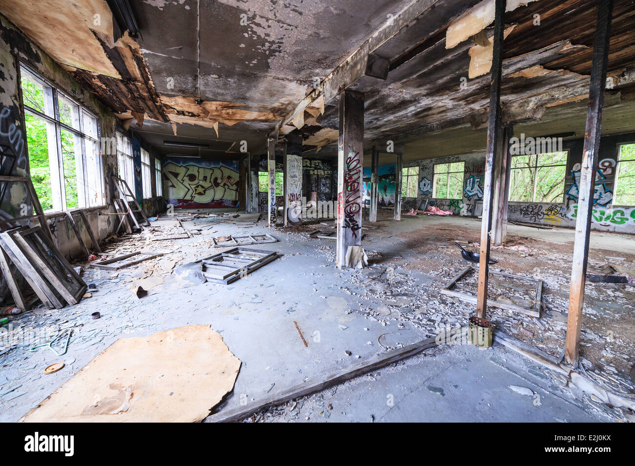 Messy abandoned factory room Stock Photo - Alamy