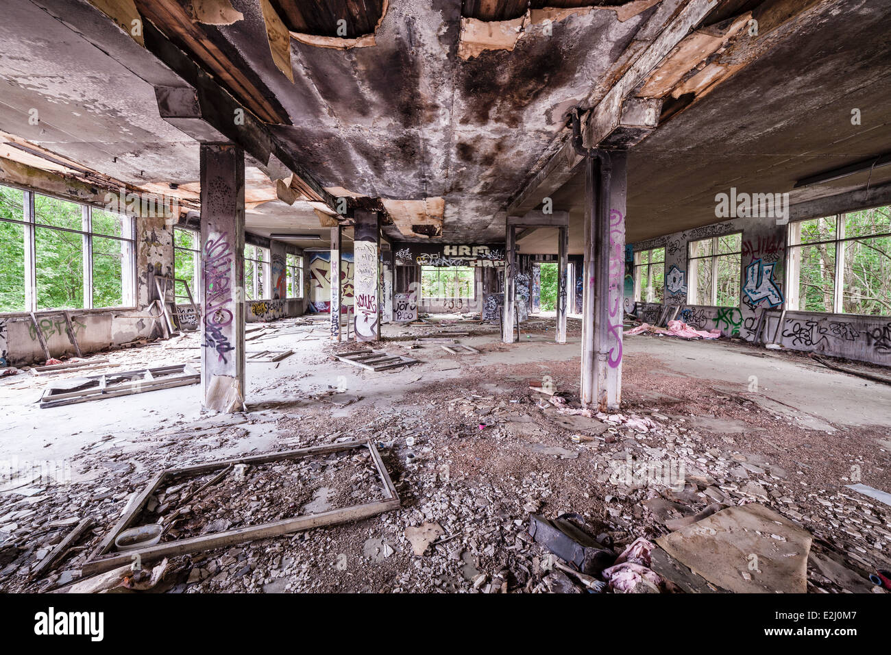 Messy abandoned factory room Stock Photo - Alamy