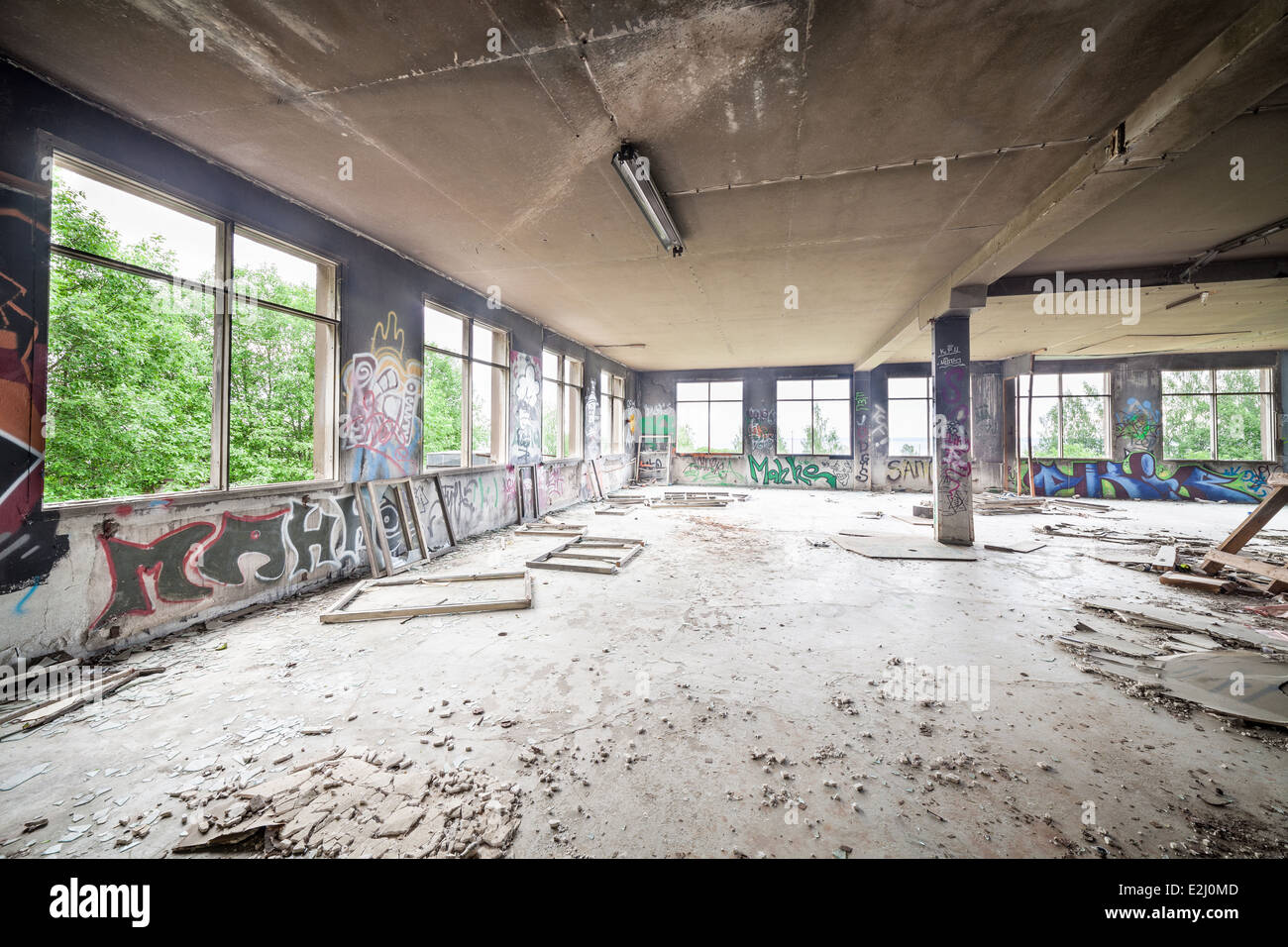 Messy abandoned factory room Stock Photo - Alamy