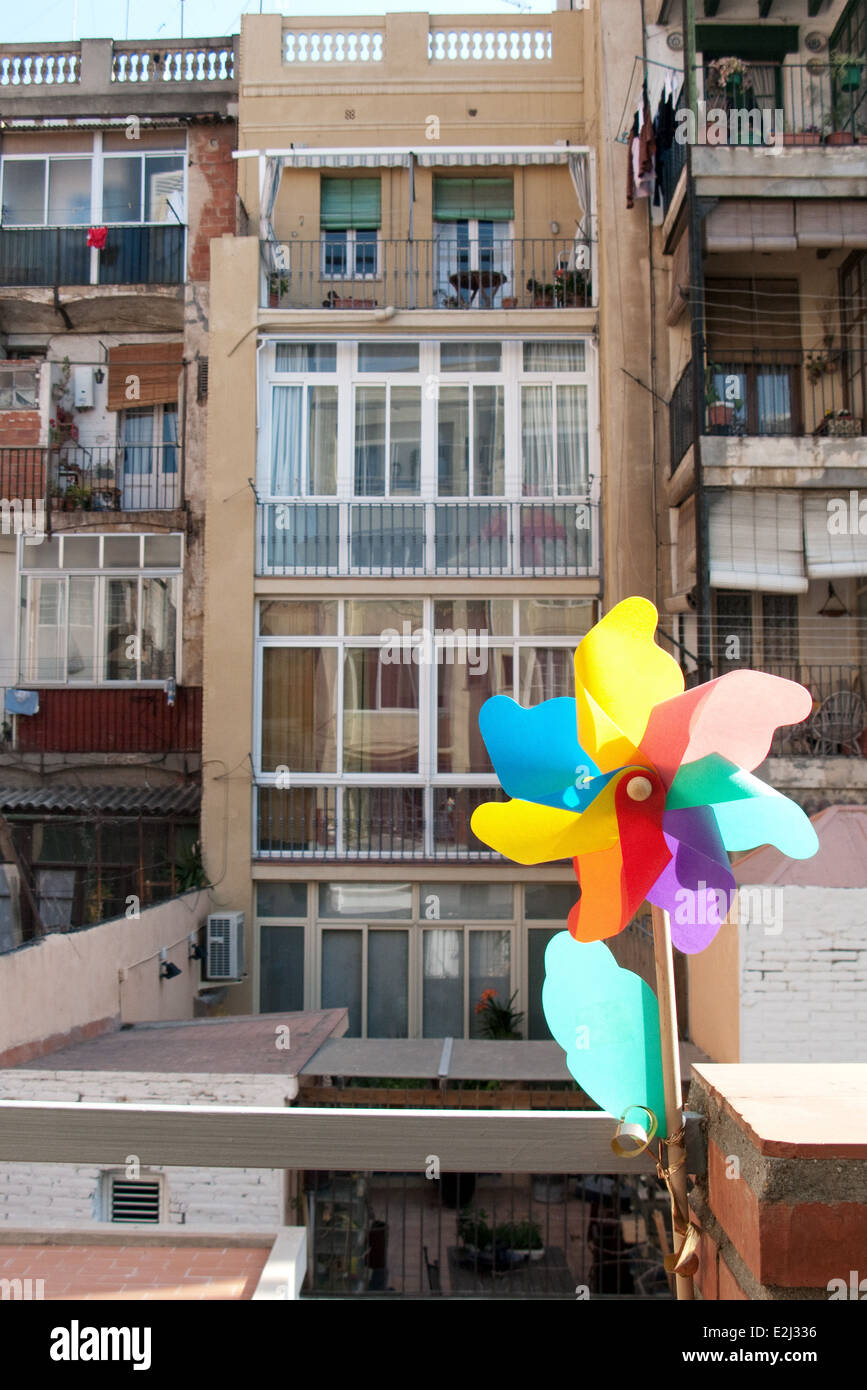 Colorful pinwheel decorating balcony of apartment building Stock Photo ...