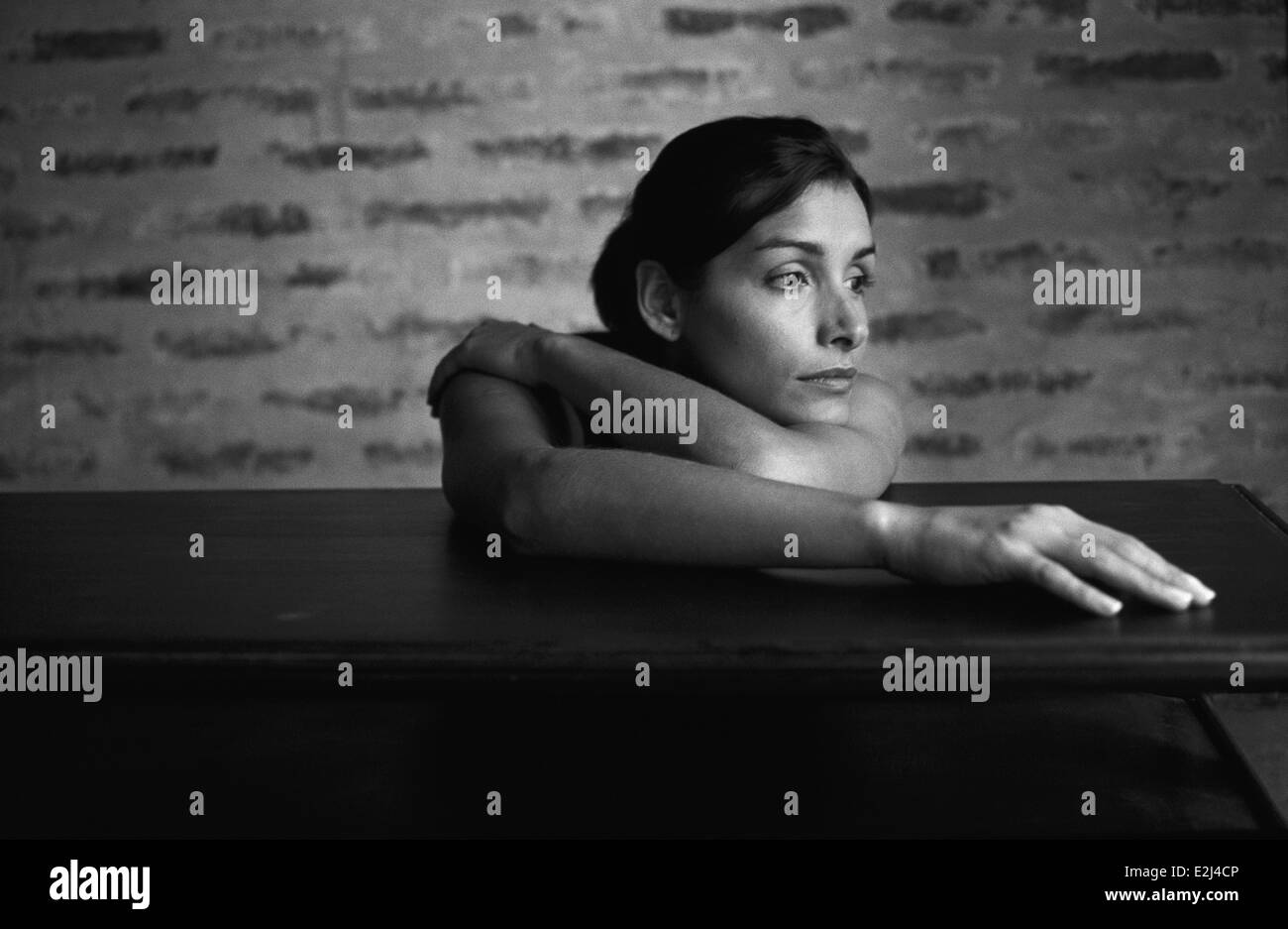 Sad head hands arms resting table hi-res stock photography and images ...