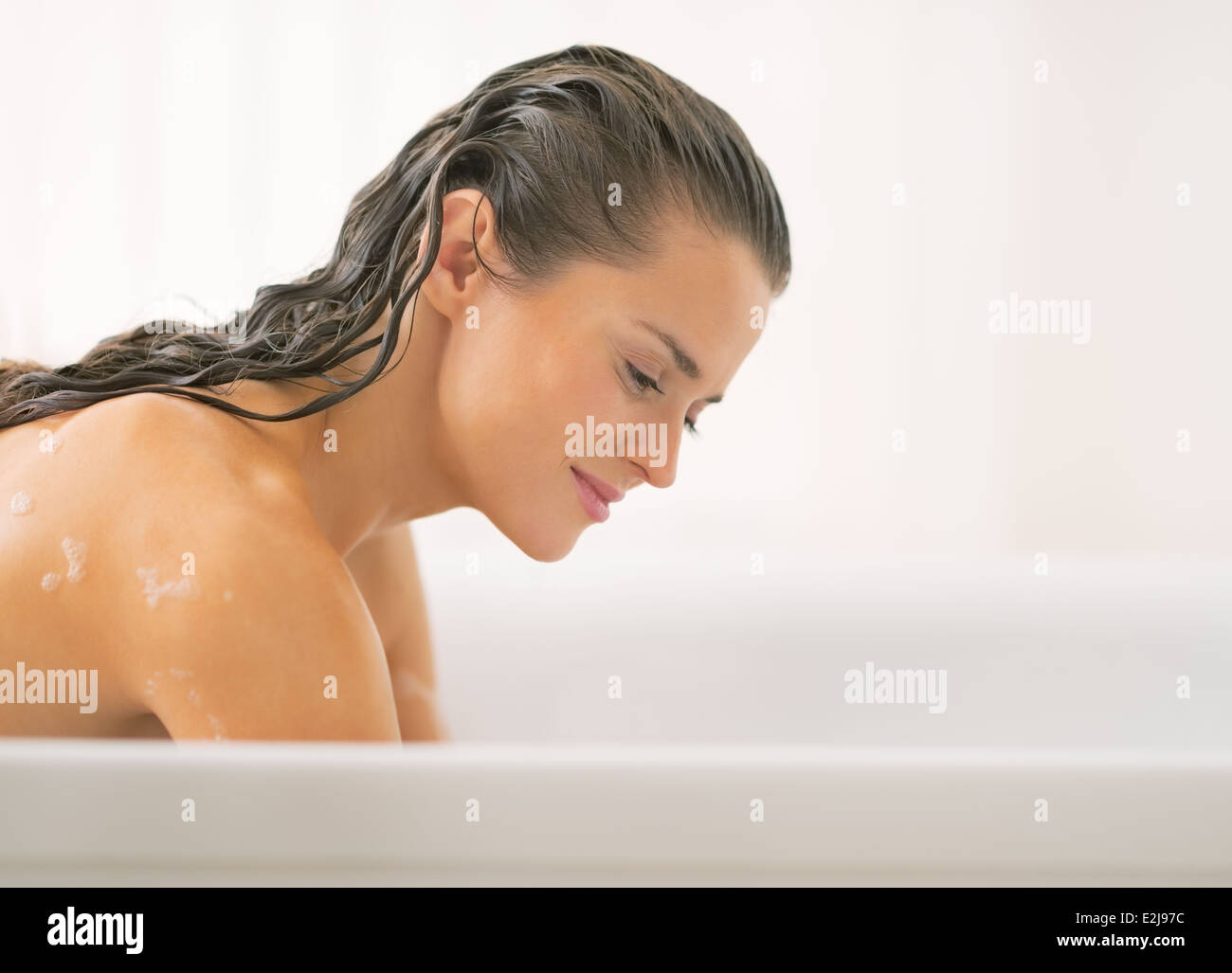 Young woman washing in bathtub Stock Photo - Alamy