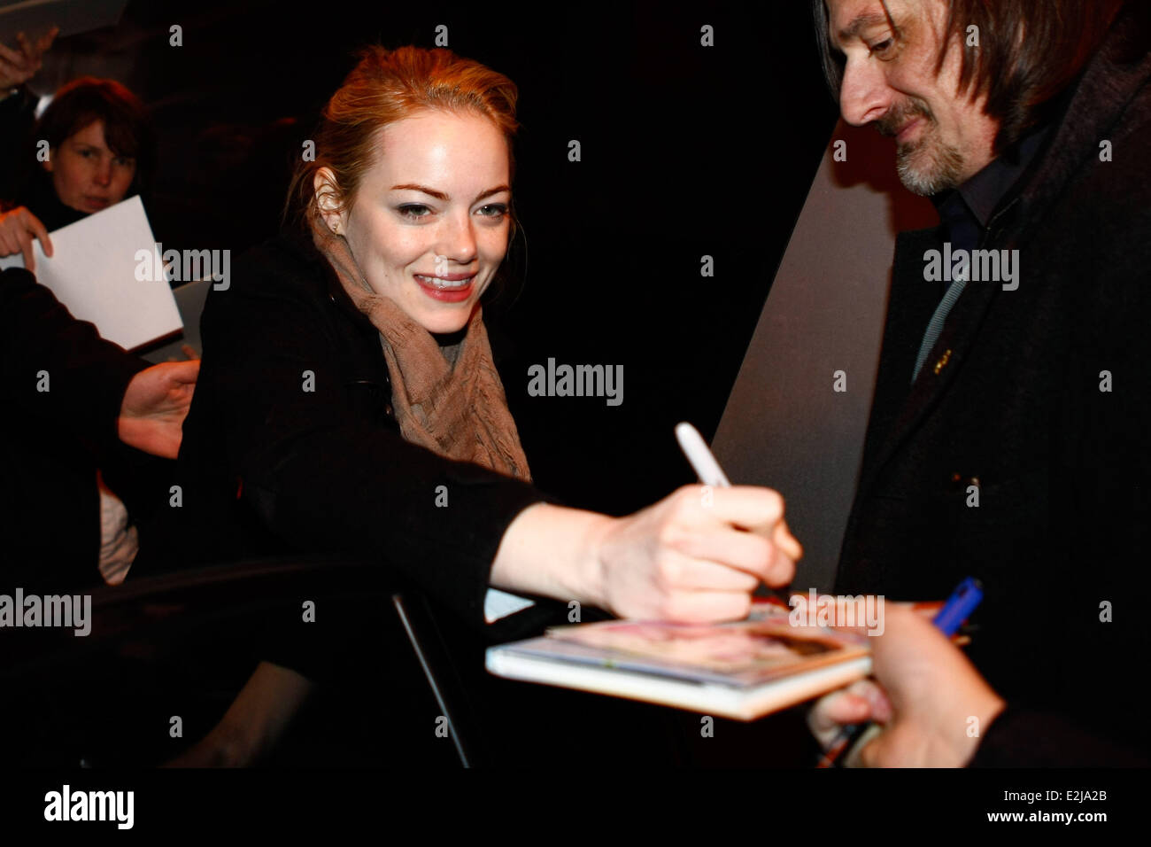 Emma Stone signing autographs whilst arriving at Tegel airport for the ...