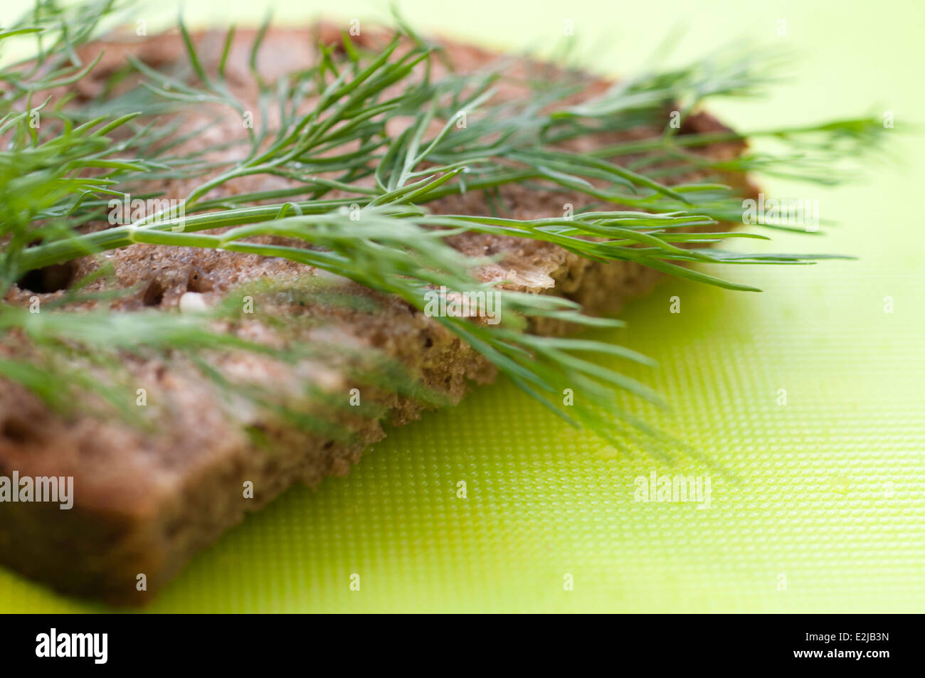 Slice of bread and dill with shallow depth of field Stock Photo - Alamy