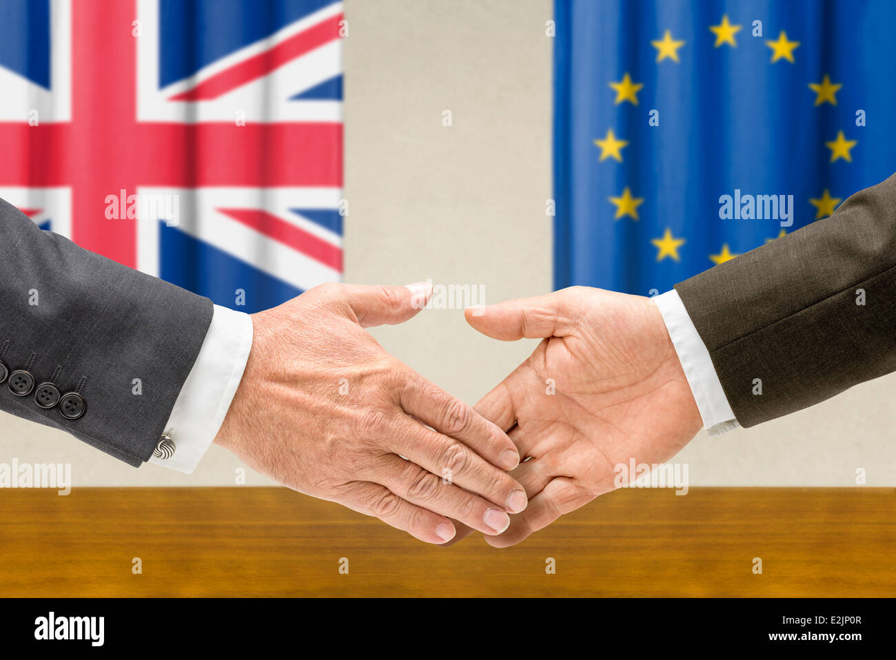 Representatives of the UK and the EU shake hands Stock Photo - Alamy