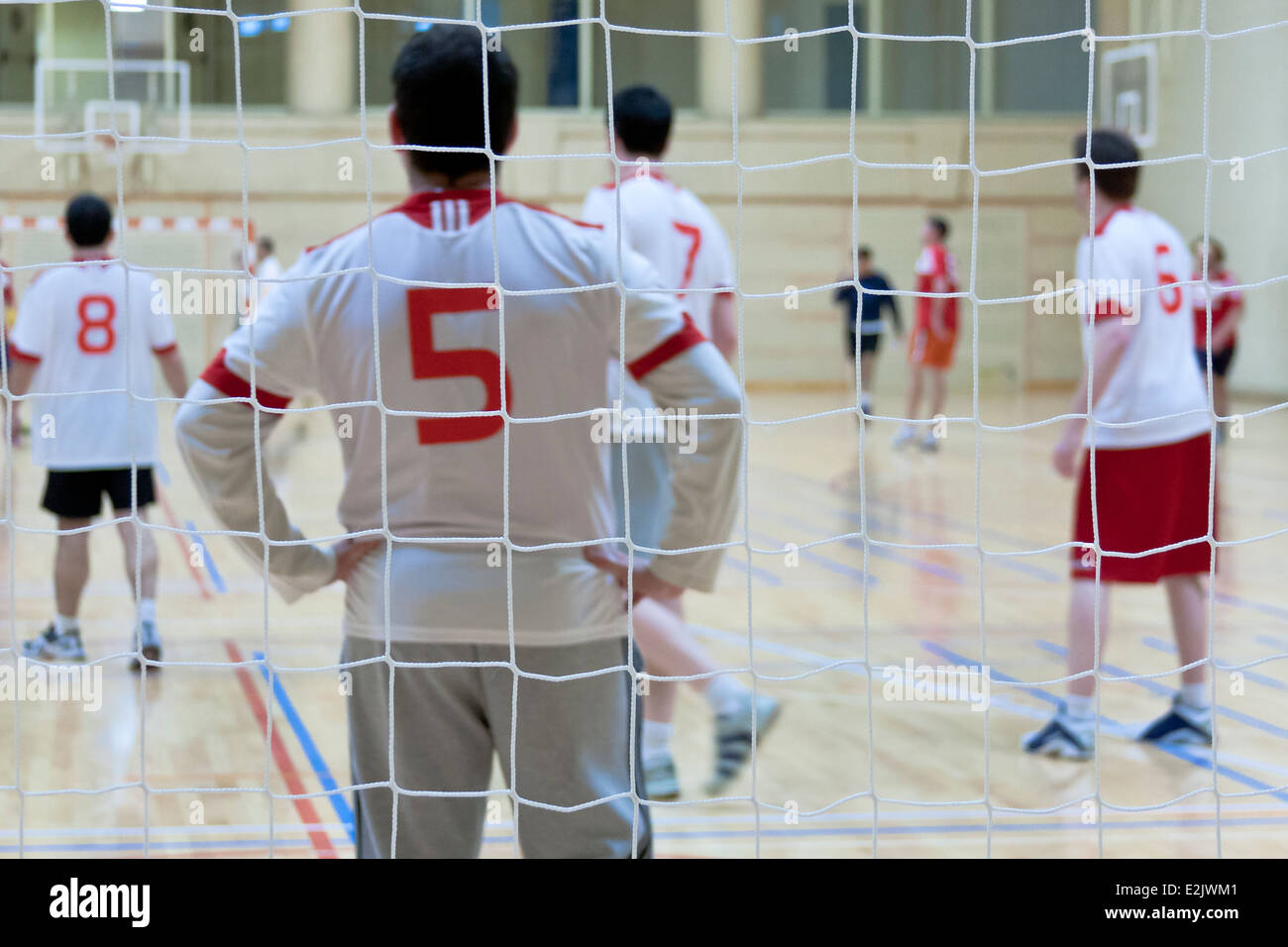 Behind goal of indoor team sport Stock Photo - Alamy
