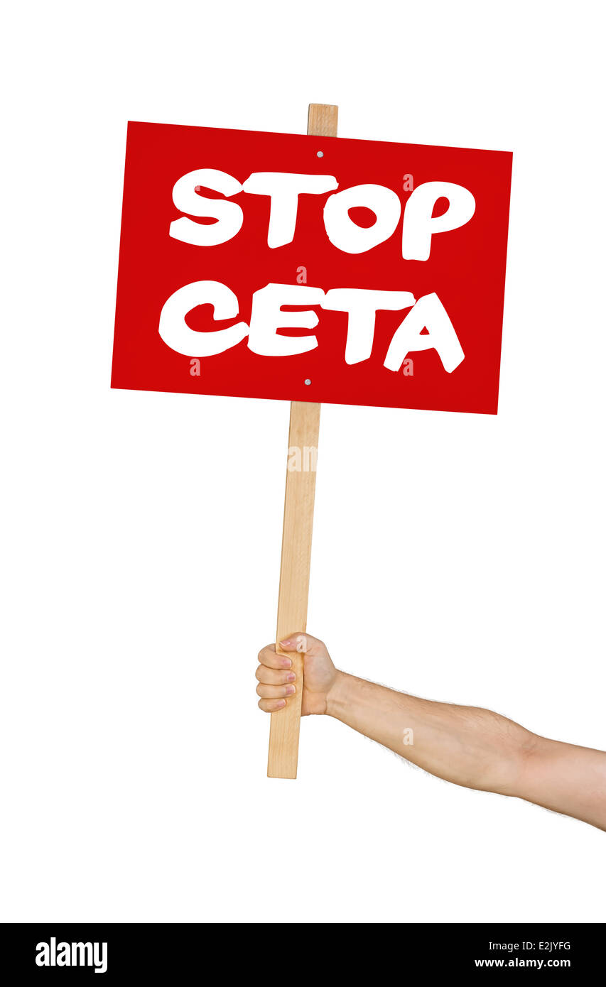 Person holding a sign saying Stop CETA Stock Photo - Alamy