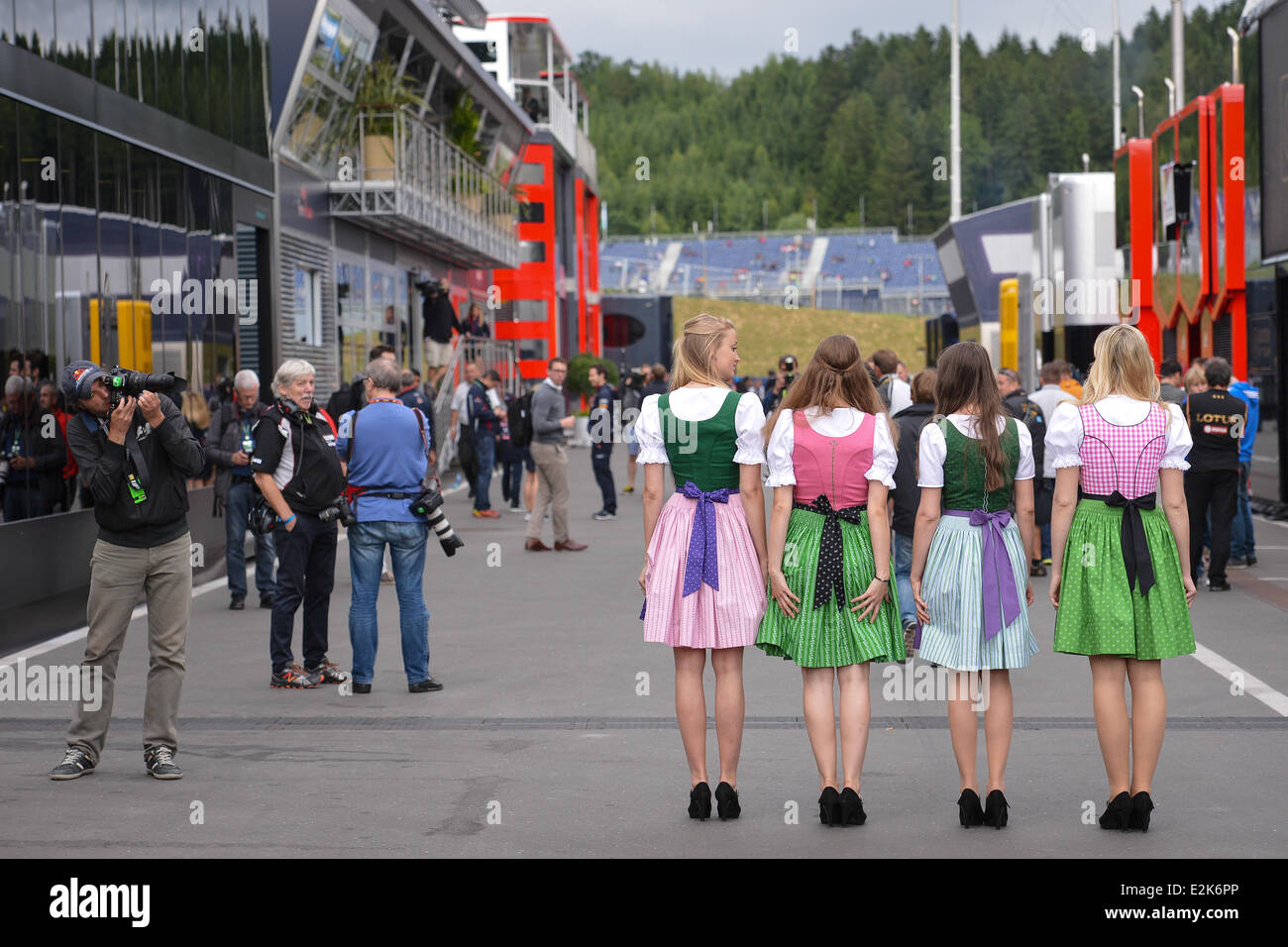 Spielberg, Austria. 20th June, 2014. Styrian grid girls walk through ...