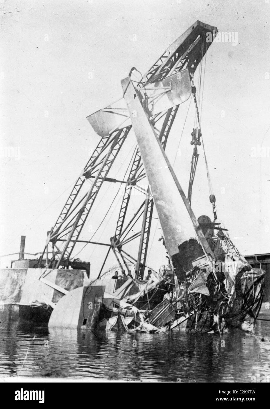 This image shows the recovery of a German aircraft, likely a WWII ...
