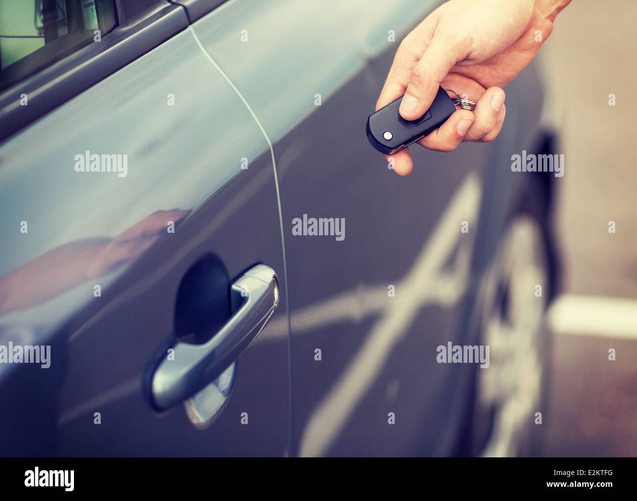 man with car key outside Stock Photo - Alamy
