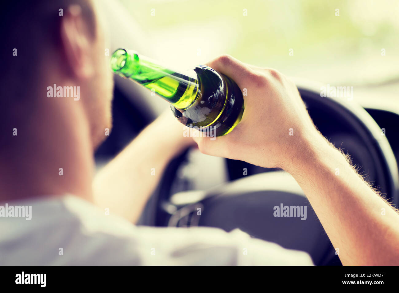 man drinking alcohol while driving the car Stock Photo - Alamy