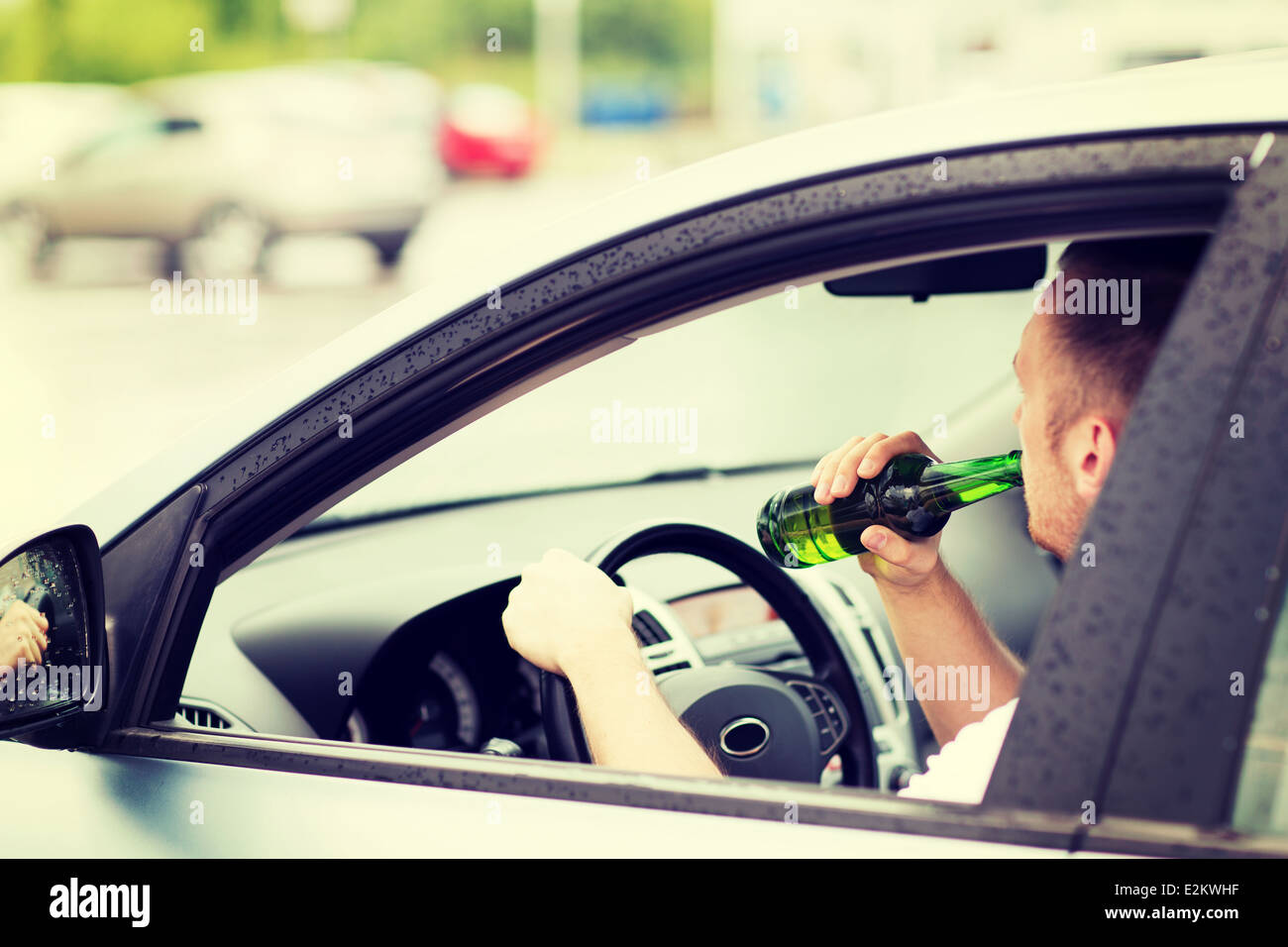 man drinking alcohol while driving the car Stock Photo - Alamy