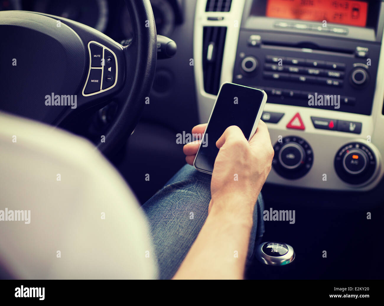 man using phone while driving the car Stock Photo - Alamy