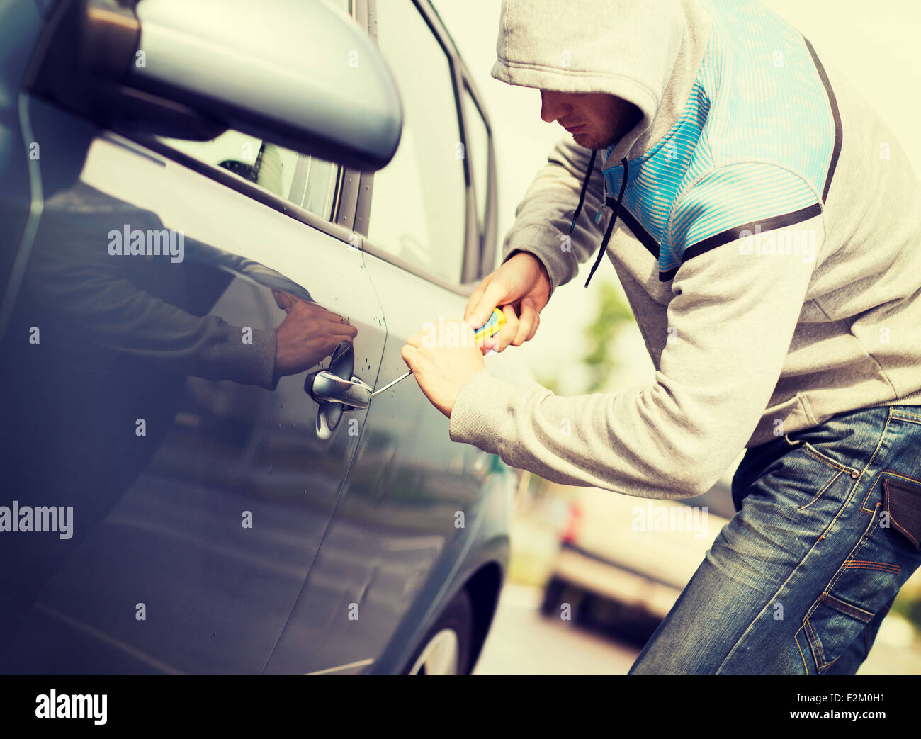 thief breaking the car lock Stock Photo - Alamy