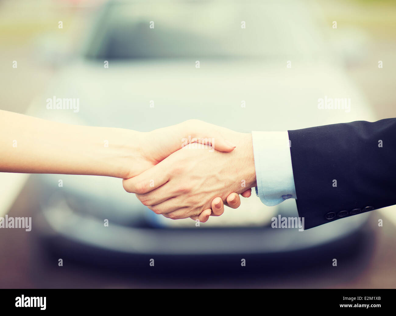 customer and salesman shaking hands Stock Photo - Alamy