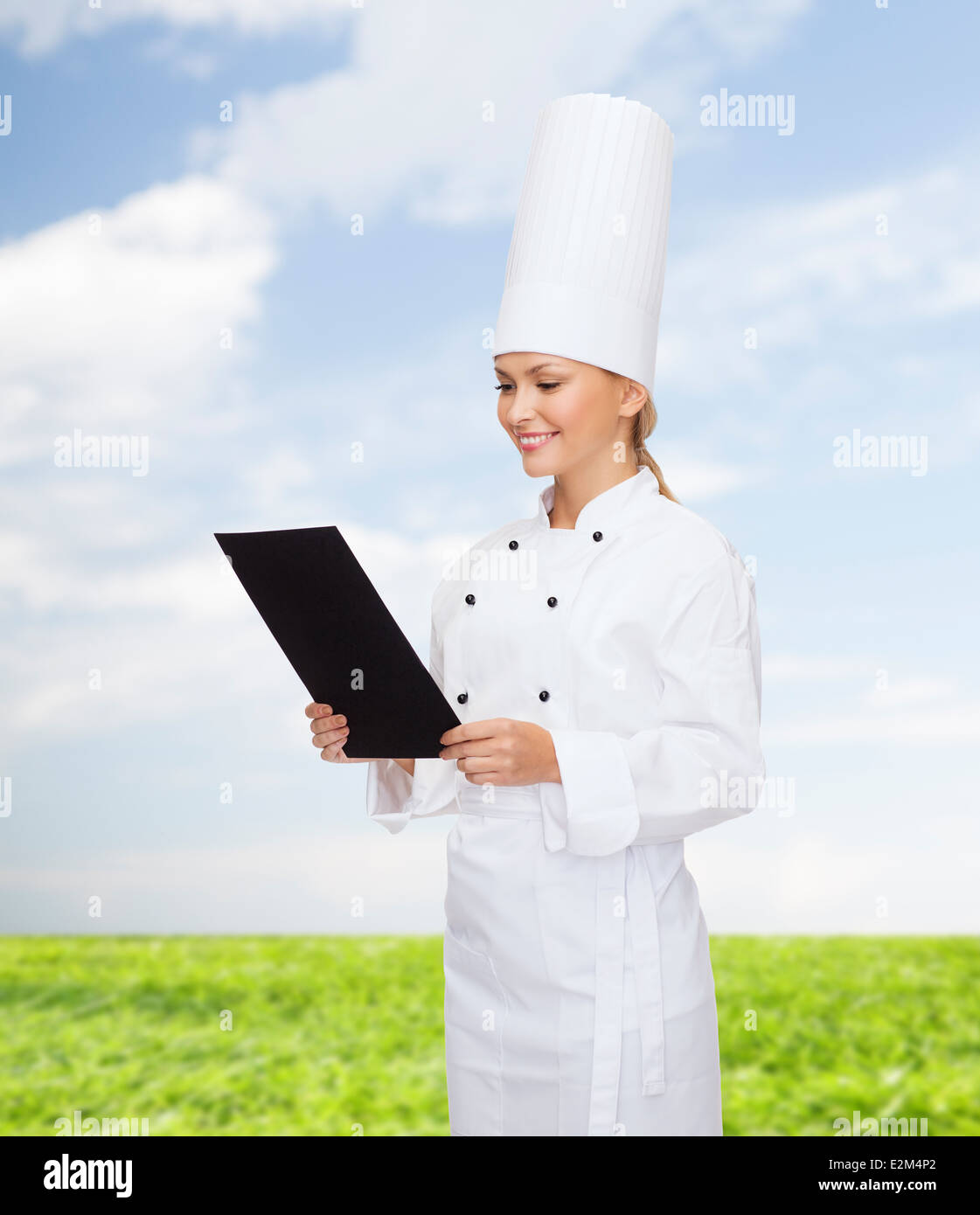 smiling female chef with black blank paper Stock Photo - Alamy