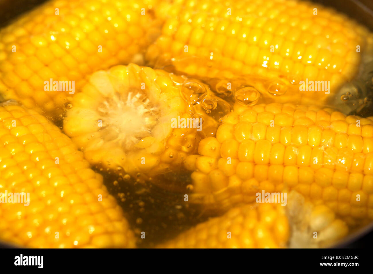 preparation of various delicious corn in boiling water Stock Photo - Alamy