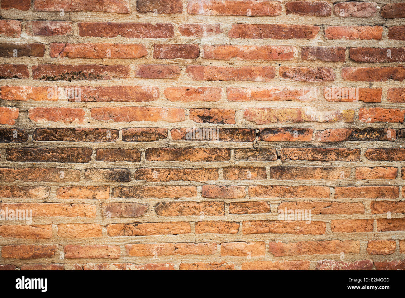 Orange old brick on wall texture background Stock Photo - Alamy