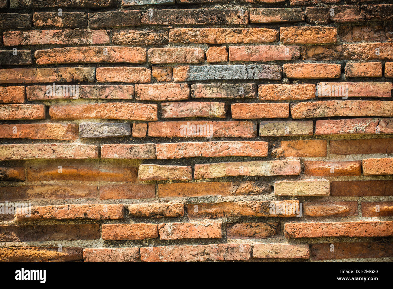 Orange old brick on wall texture background Stock Photo - Alamy