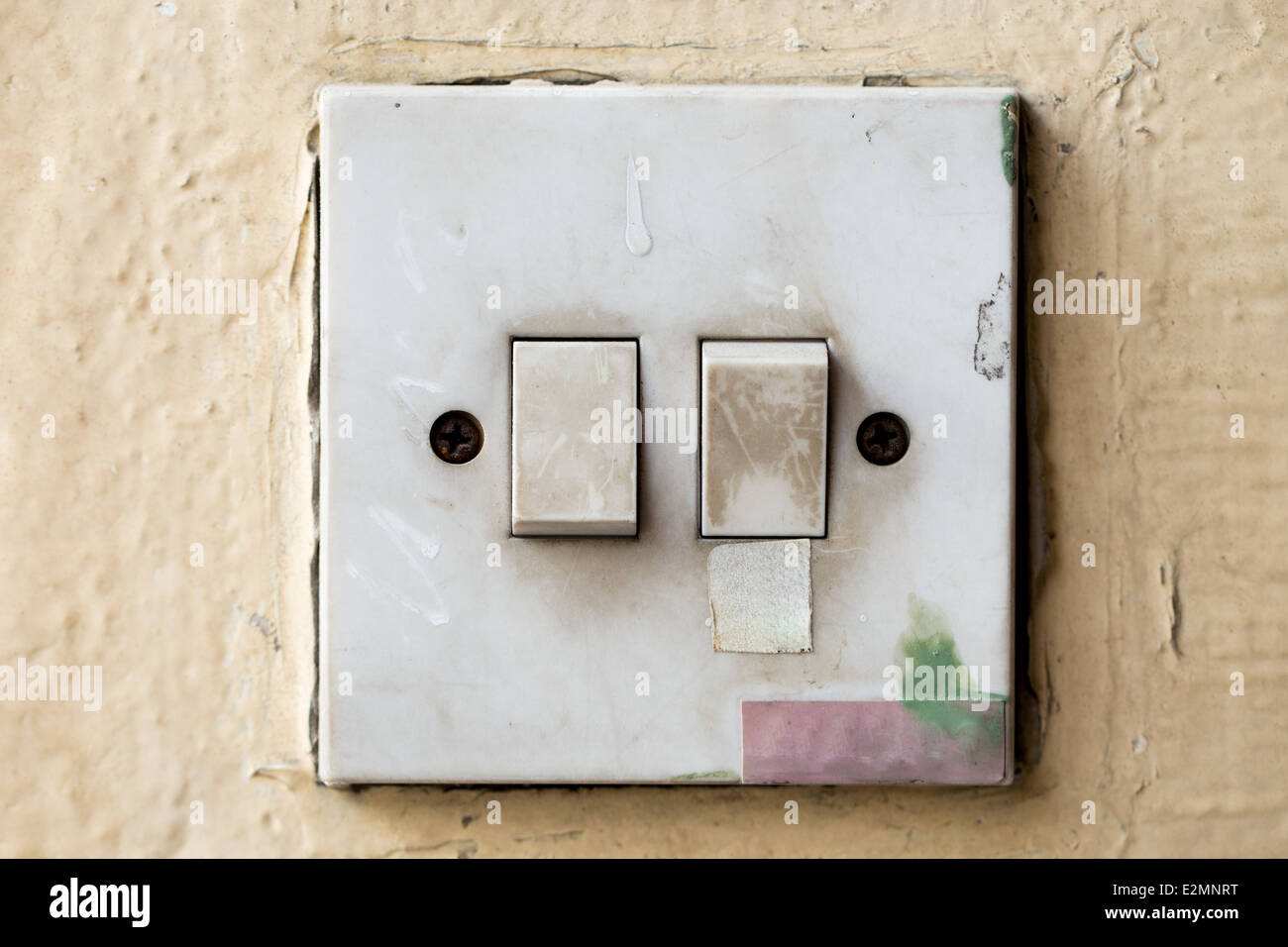 Old and dirty Light control switch on yellow background Stock Photo - Alamy