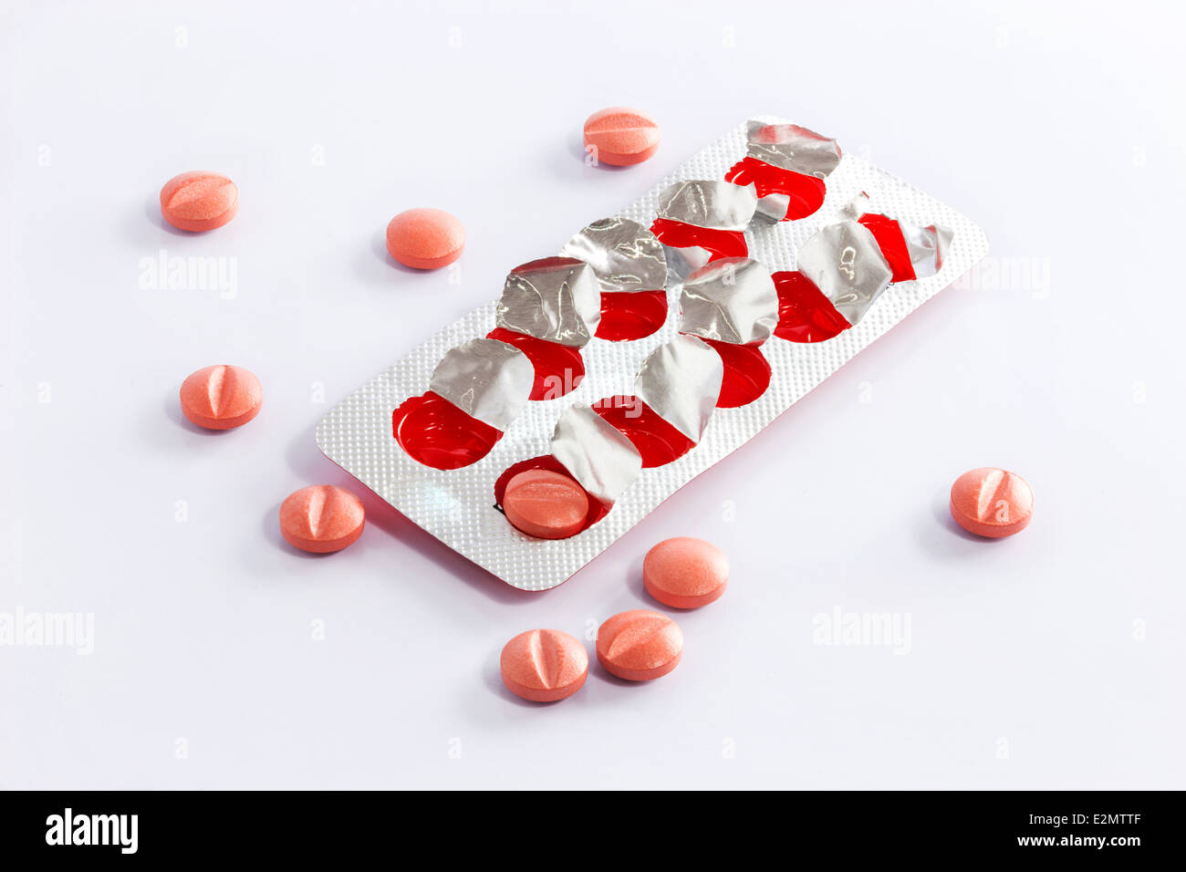 opened pack of pills in blister red packs isolated on white background ...