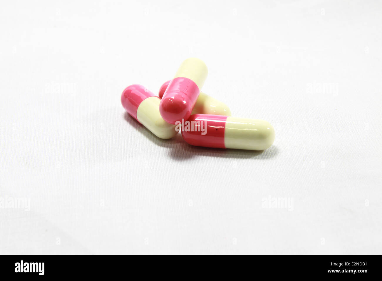 Drug capsule in white isolated background Stock Photo - Alamy